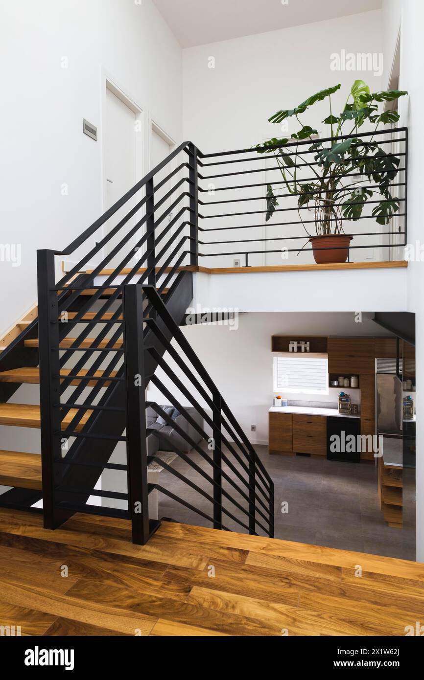 American walnut wood and black powder coated cold rolled steel stairs ...