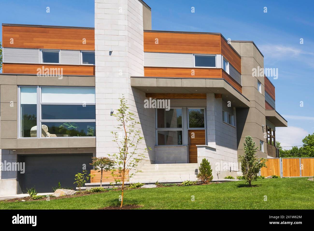 Two story grey and charcoal stone with cedar wood siding modern cube ...