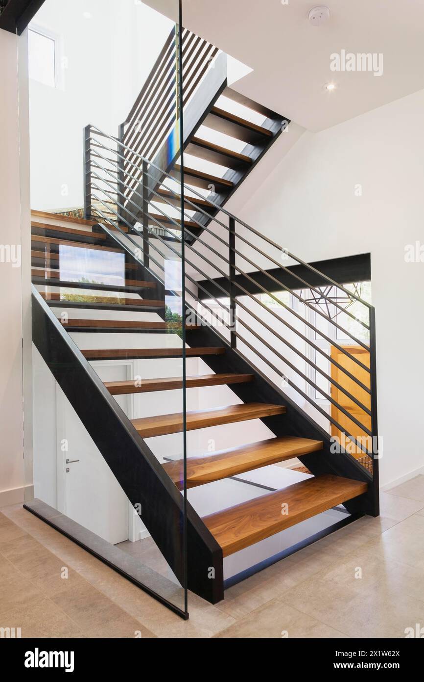 American walnut wood and black powder coated cold rolled steel stairs ...