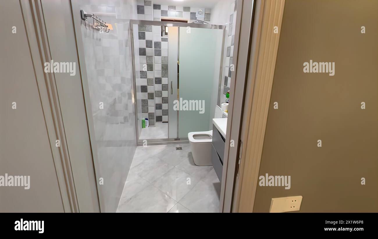 Interior of a modern bathroom with shower and toilet. Nobody inside ...