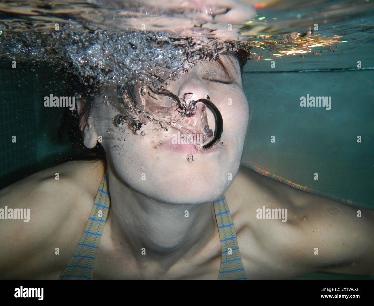 Woman Face with Eyes Closed Underwater with Bubbles in Switzerland ...