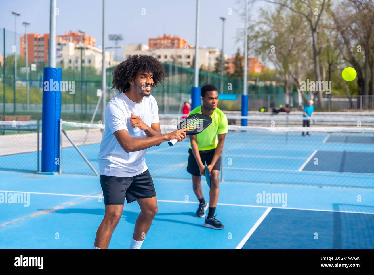 Two african american young sportive male friends enjoying playing ...