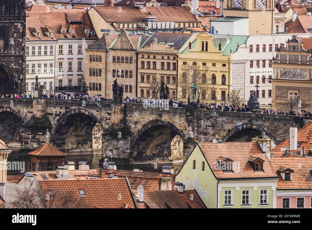 Figures of saints, Old Town, Charles Bridge Prague, crowds of people ...