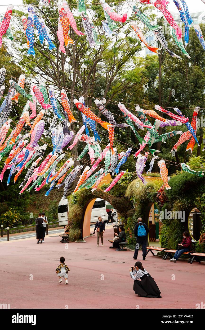 Tokyo, Japan. 18th Apr, 2024. Koinobori (carp banners) are on display ...