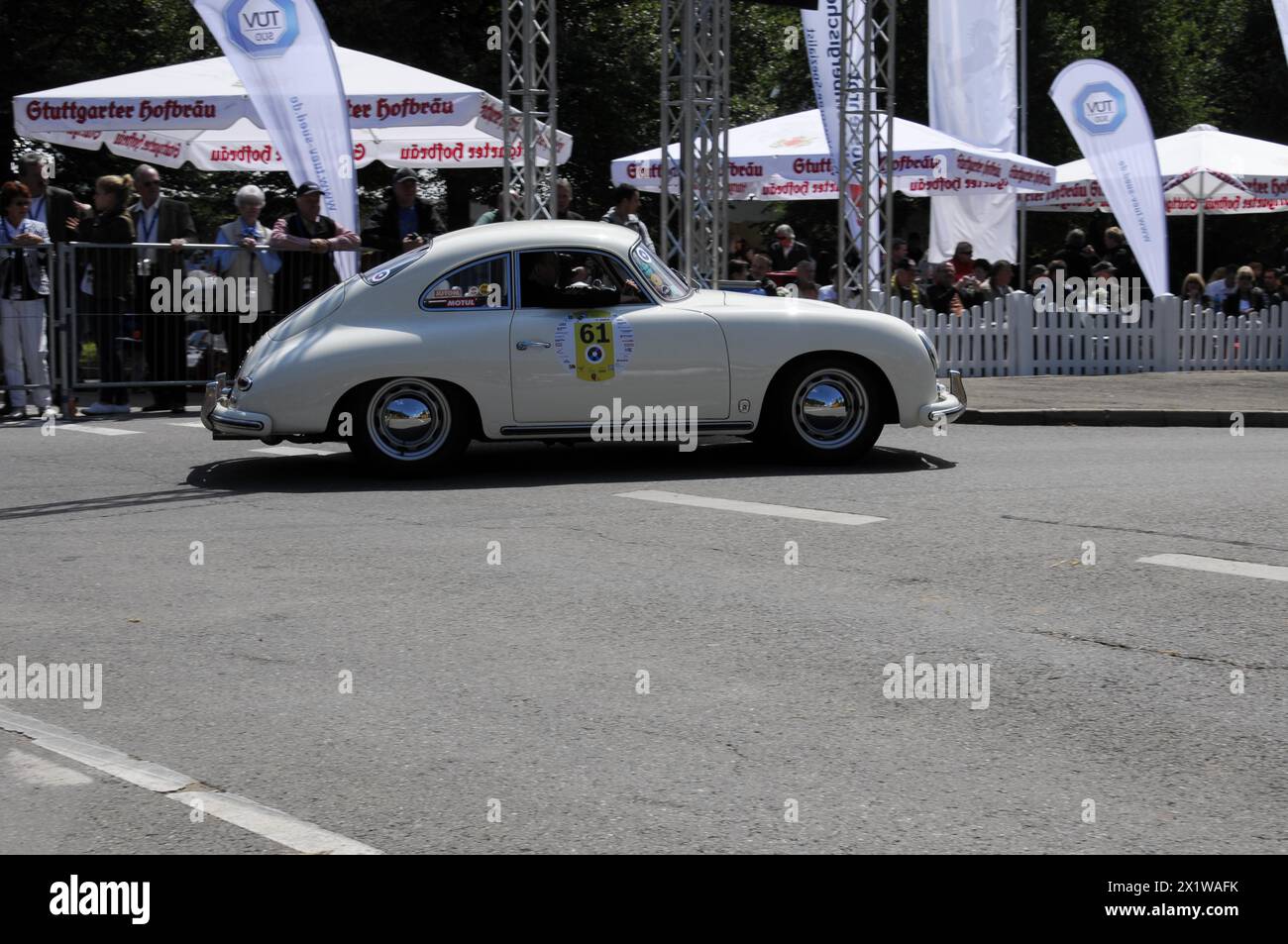 Ivory-coloured Porsche Coupe classic car at a motorsport event ...
