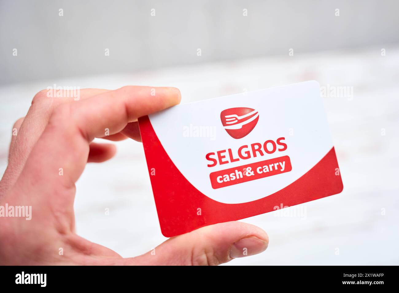 Augsburg, Bavaria, Germany - April 17, 2024: Hand holding a Selgros ...