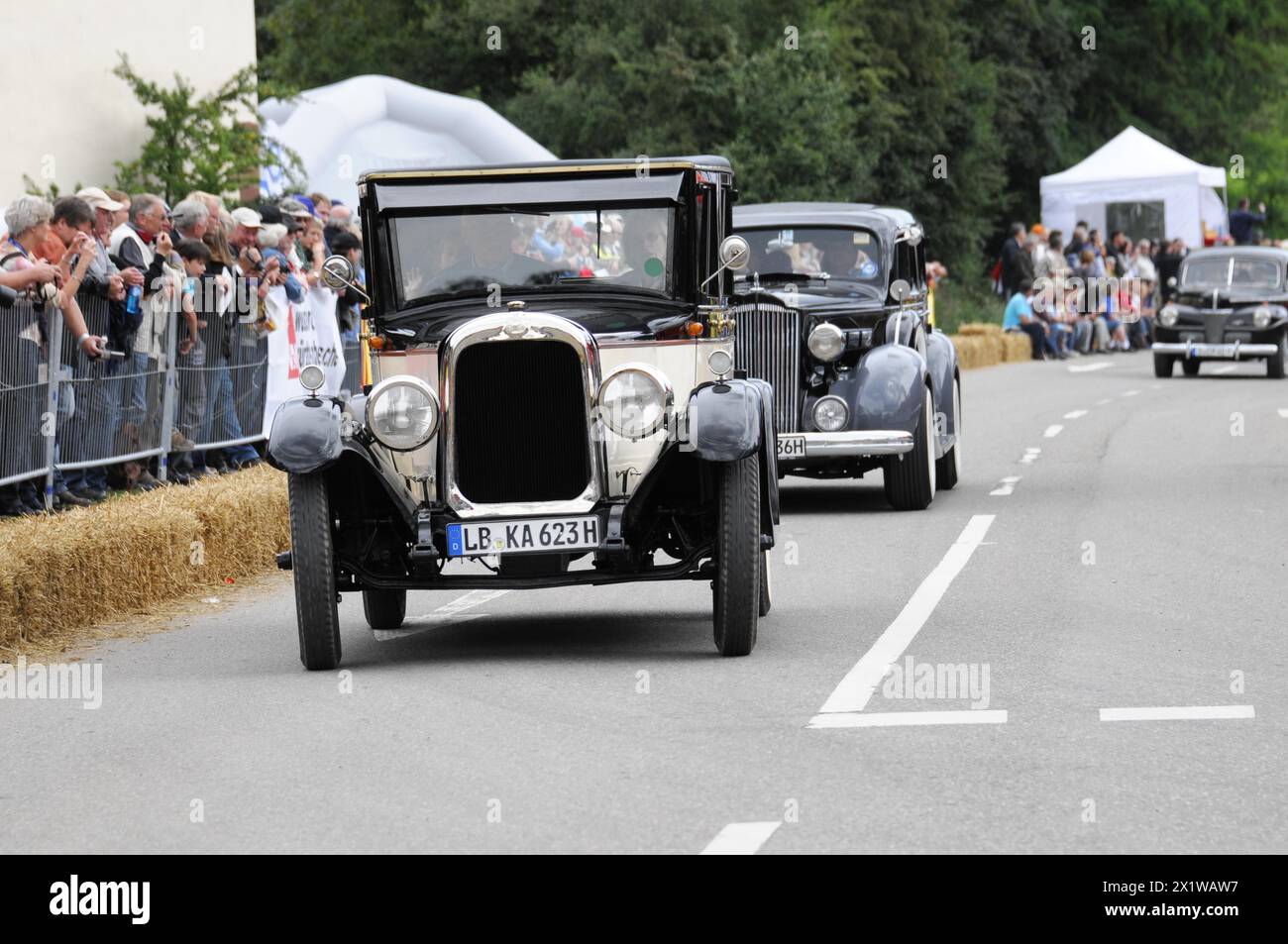 Cleveland Six, built in 1925, classic cars of various models drive past ...