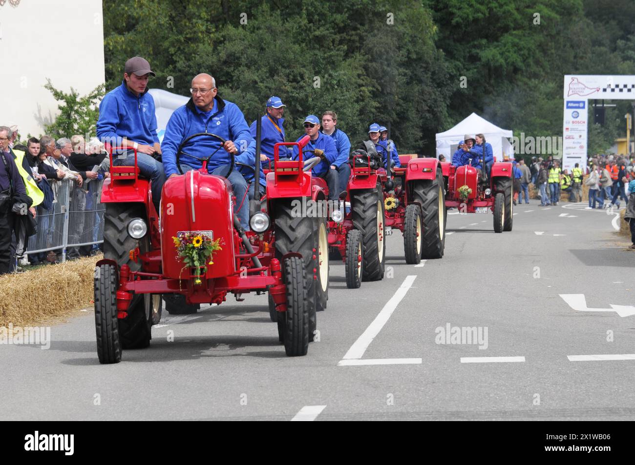 Porsche Diesel Tractors, A row of tractors and their drivers at a ...