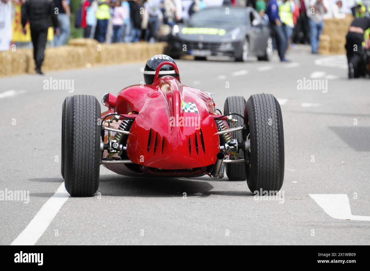 A historic racing car in front of an audience at a road race, SOLITUDE ...