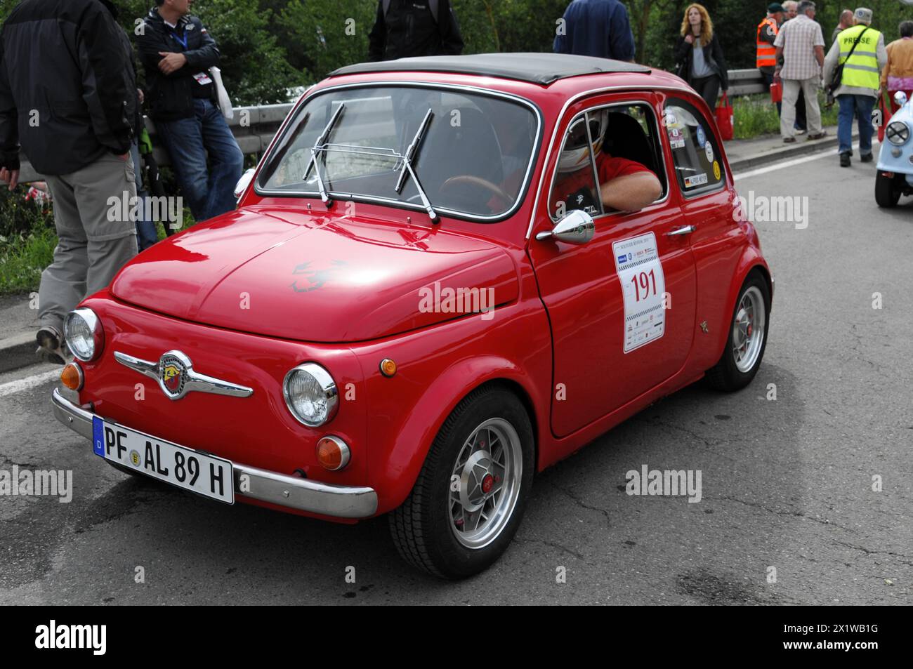 A red Fiat 500 classic car with the number 191 at a road race, SOLITUDE ...