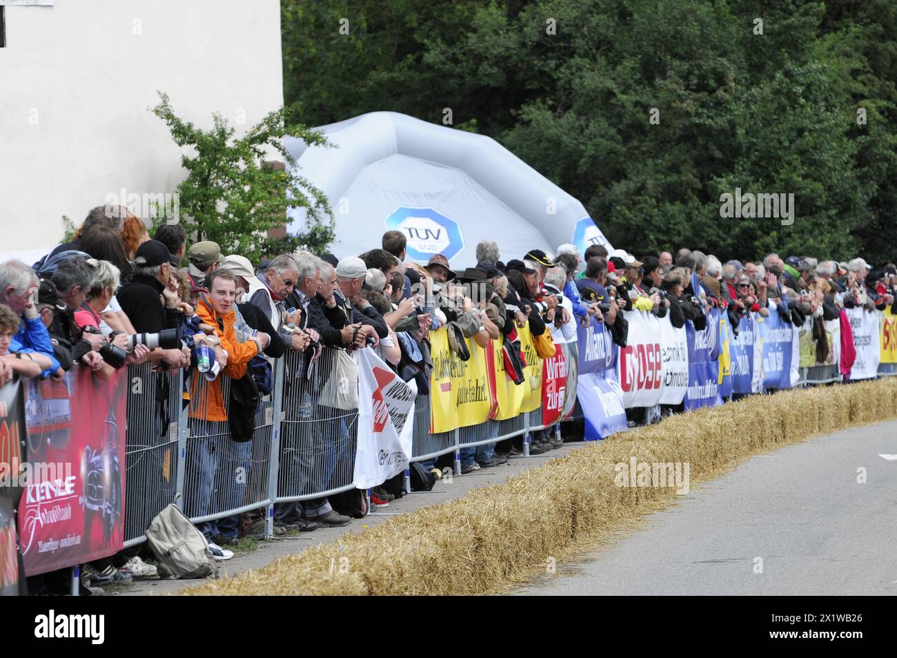 A crowd observes an event behind a barrier, SOLITUDE REVIVAL 2011 ...