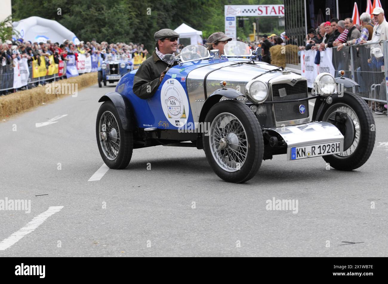 Blue classic car with driver in racing suit on a race track, SOLITUDE ...