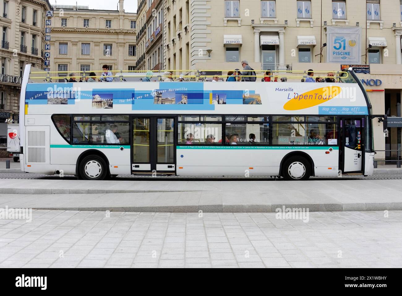 Marseille, sightseeing bus with passengers travelling through the city ...