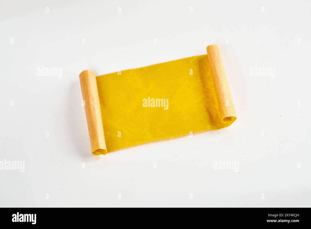 A piece of paper, crumpled paper, an unfolded sheet of paper on a white ...