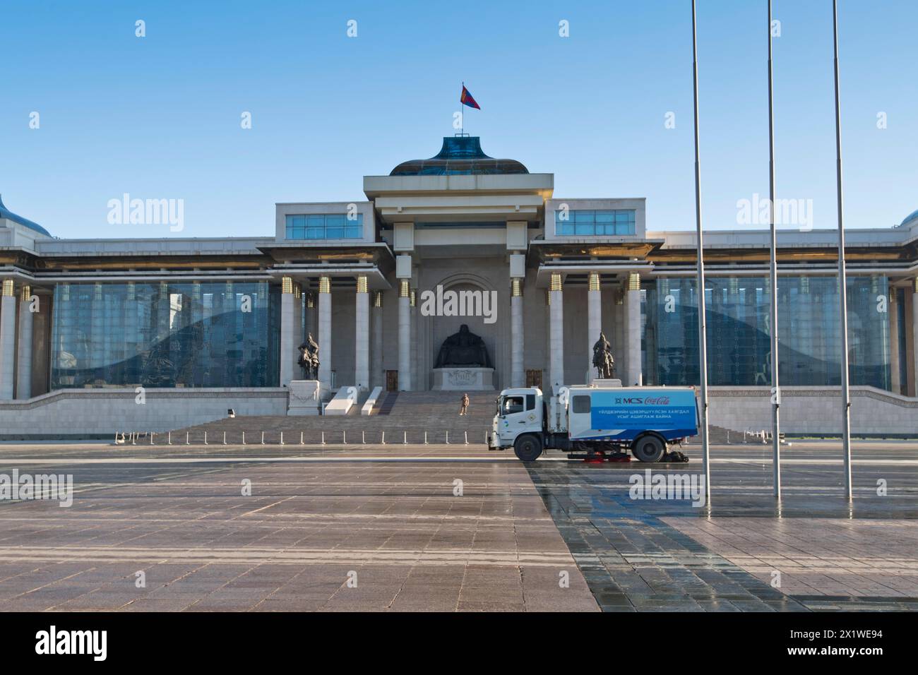 Cleaning vehicle, sweeper in front of Mongolian government palace ...