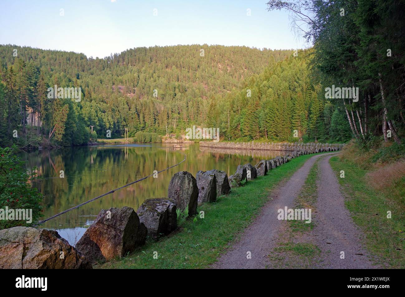 Historic towpath with stone markings along a calm waterway, Telemark ...