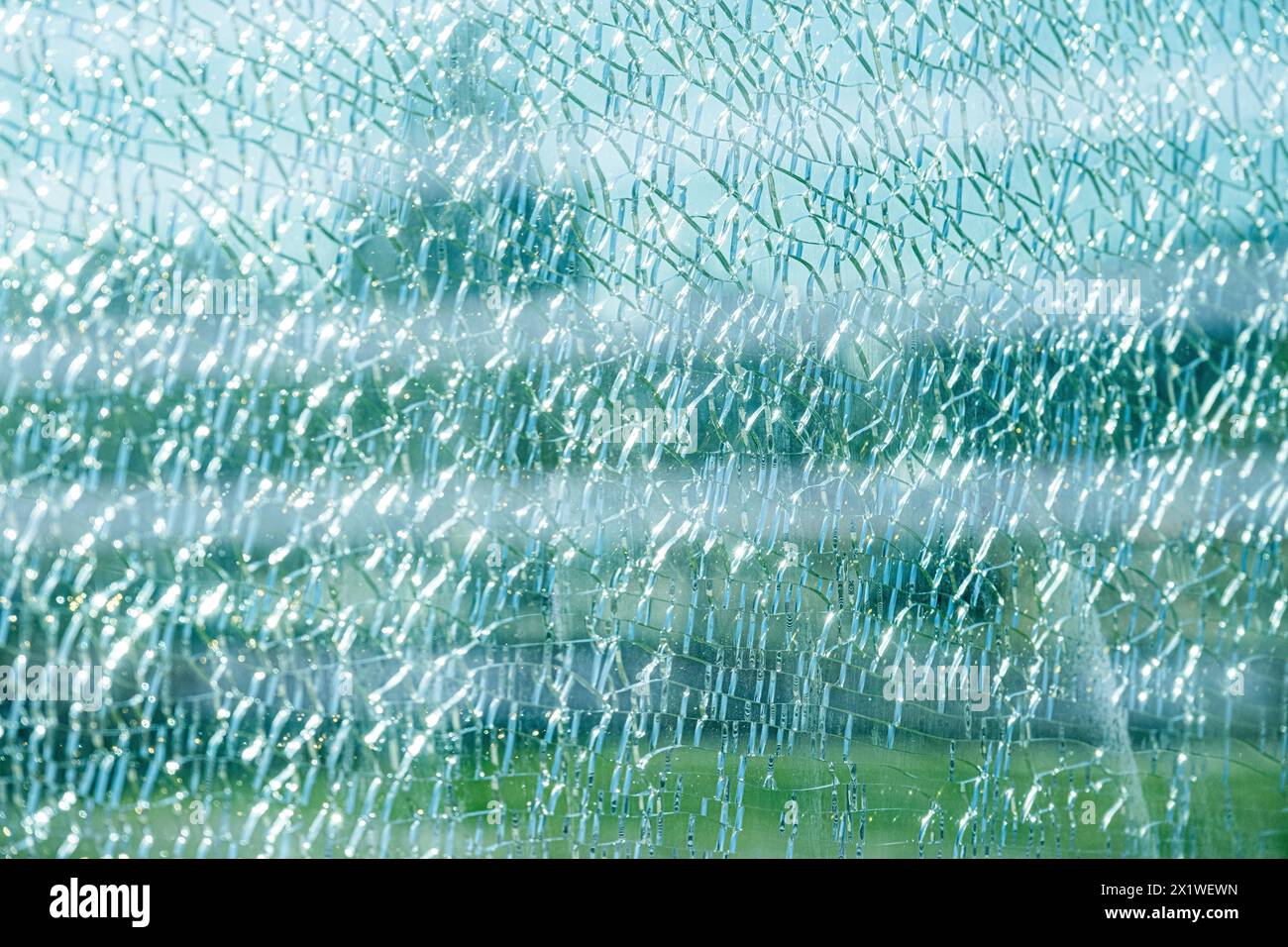 Cracked glass of a laminated glass pane Stock Photo - Alamy