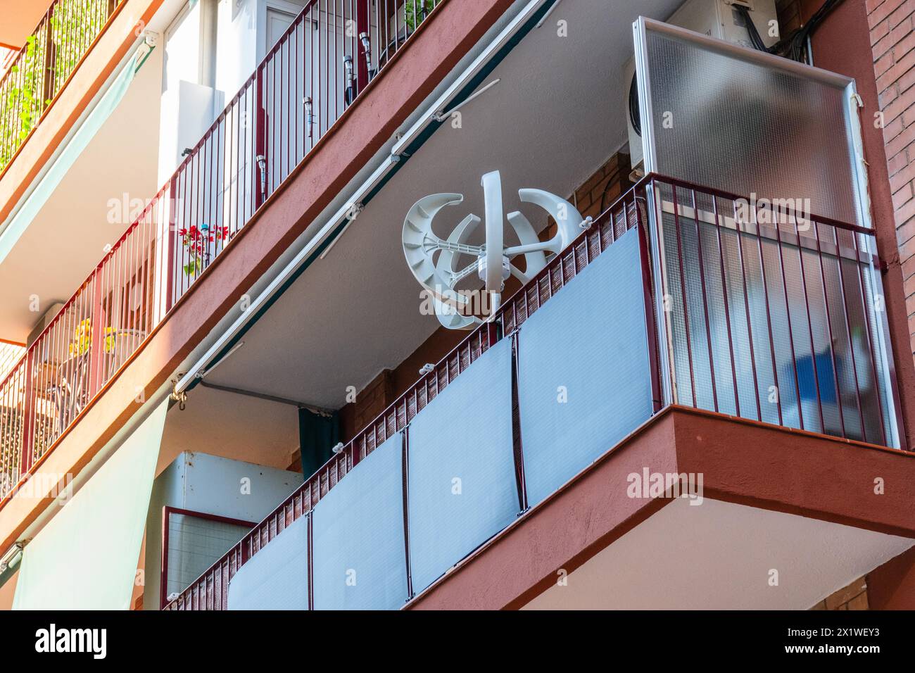Balcony power plant and mini wind turbine on a balcony of a high-rise ...