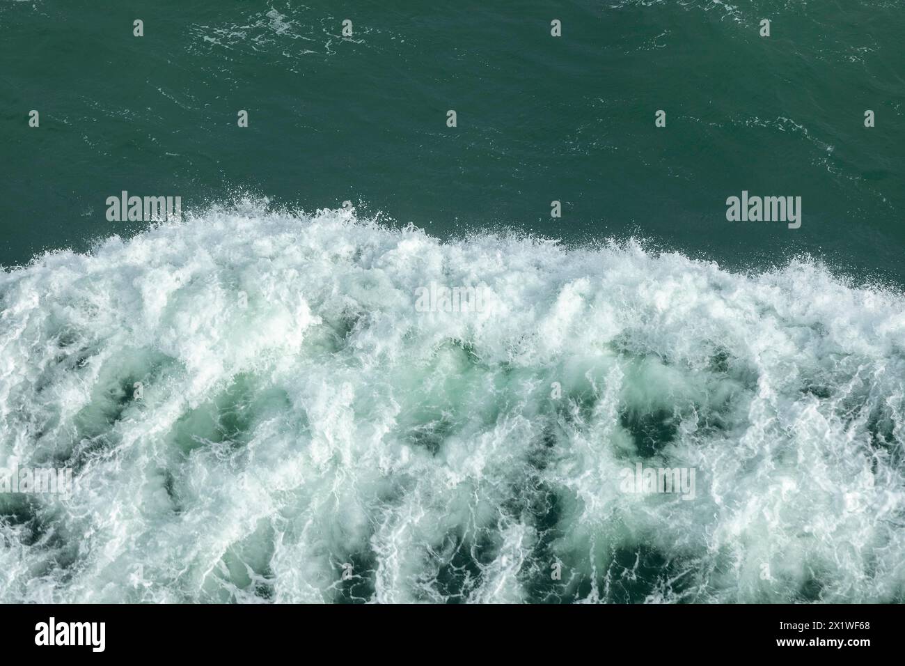 Bow wave of a ferry, spray, Irish Sea near Dublin, Republic of Ireland ...
