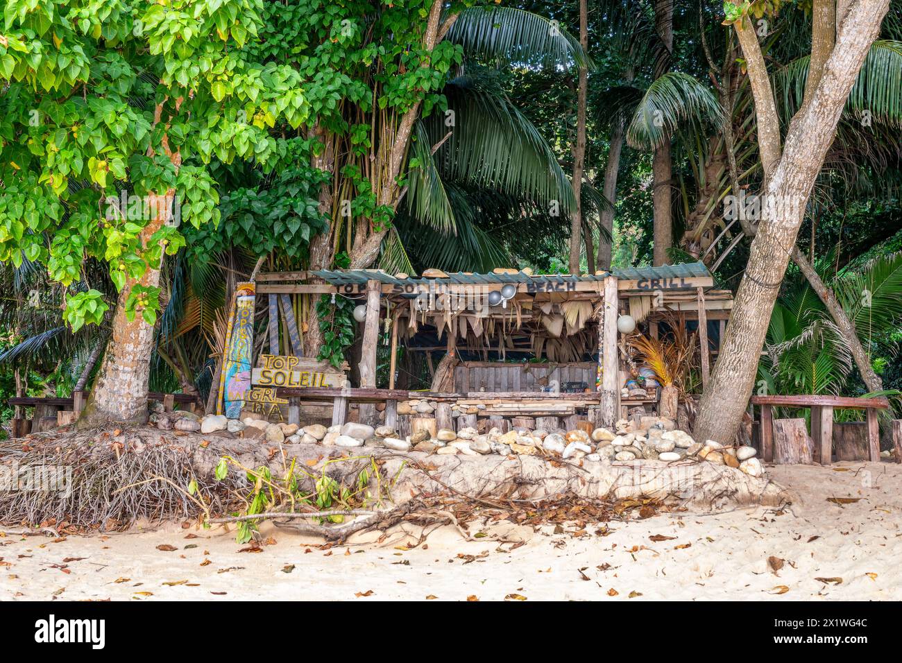 Top Soleil, Beach bar under trees on a sandy beach on the tropical ...
