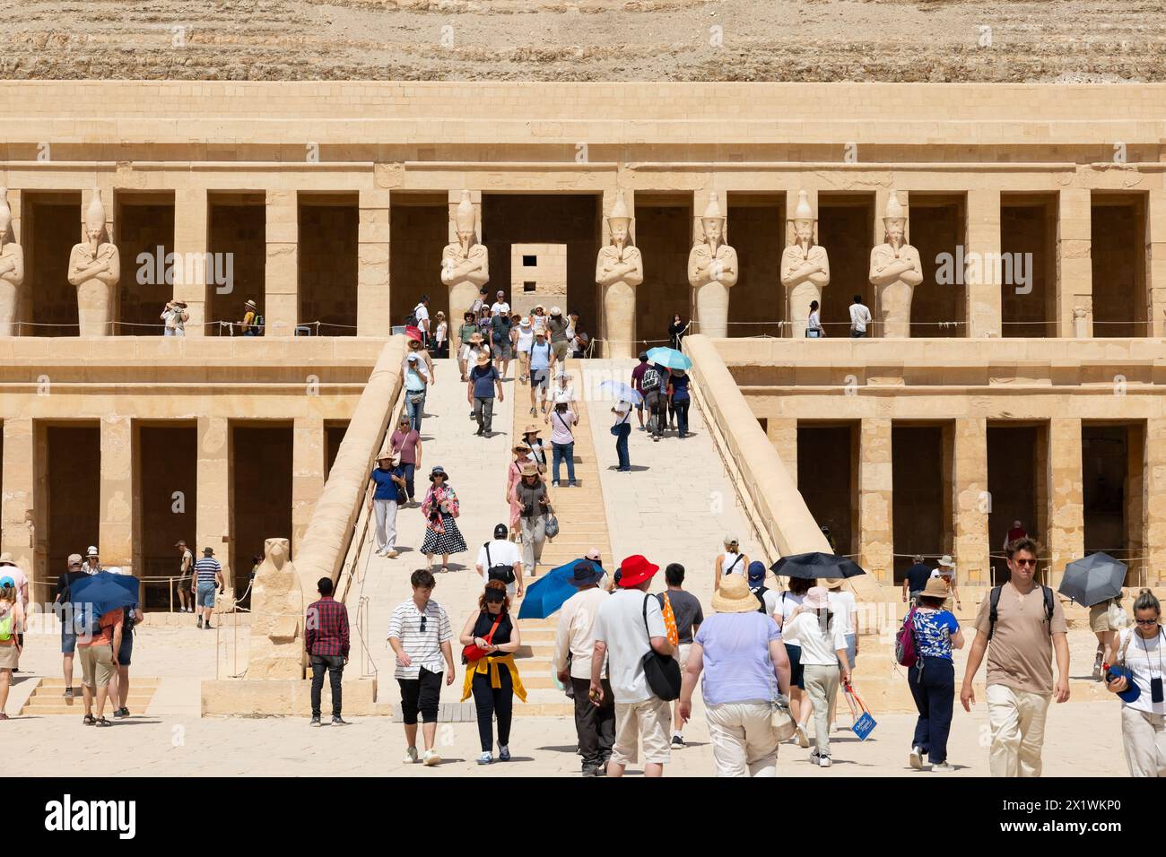 Tourists climb the ramp to the Mausoleum, necropolis temple to Queen ...