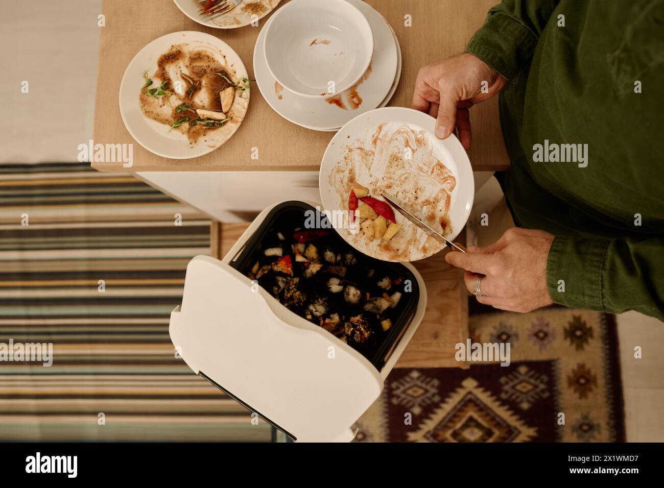 Man throwing food in bin hi-res stock photography and images - Alamy