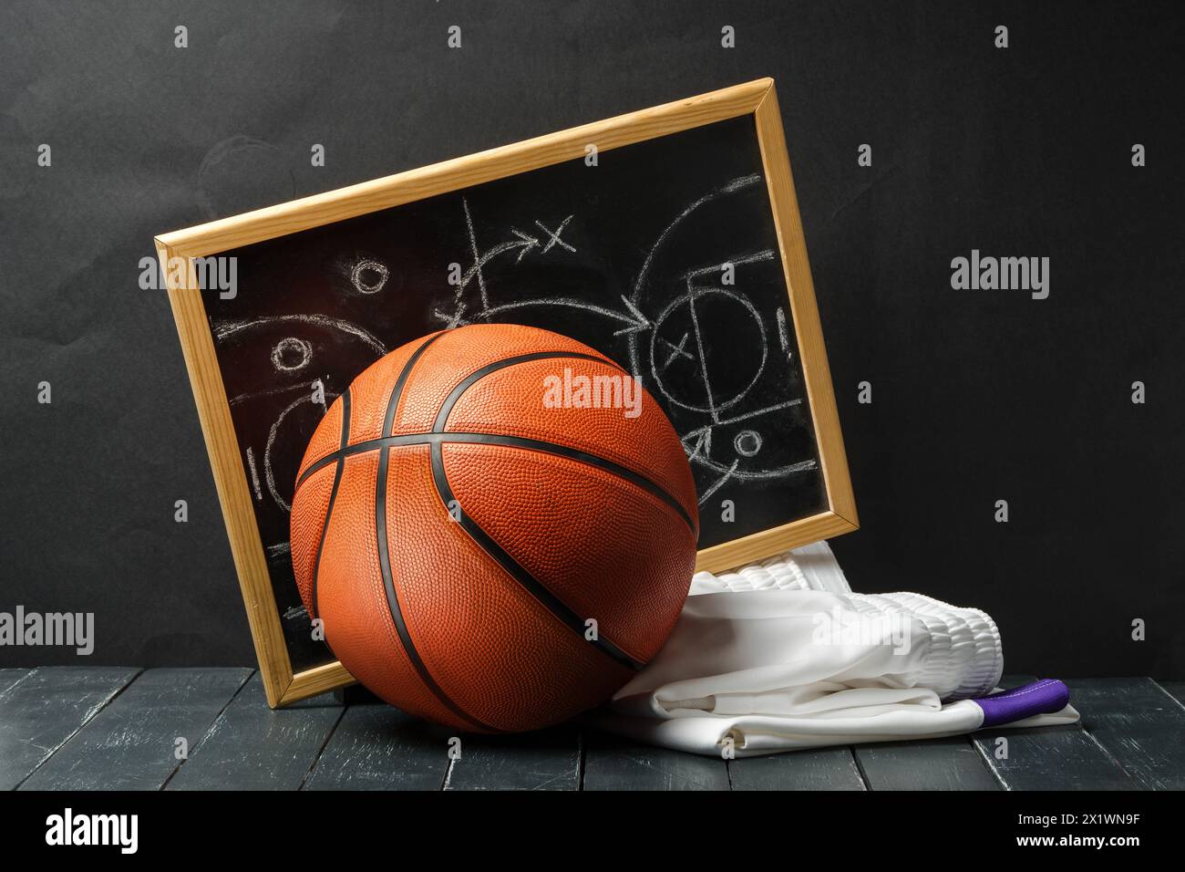 Basketball Tactics Planning With Ball and Blackboard on Wooden Floor ...