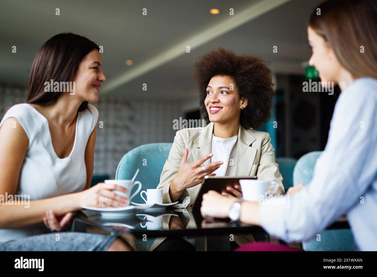 Business woman and her clients discuss business ideas and collaborate ...