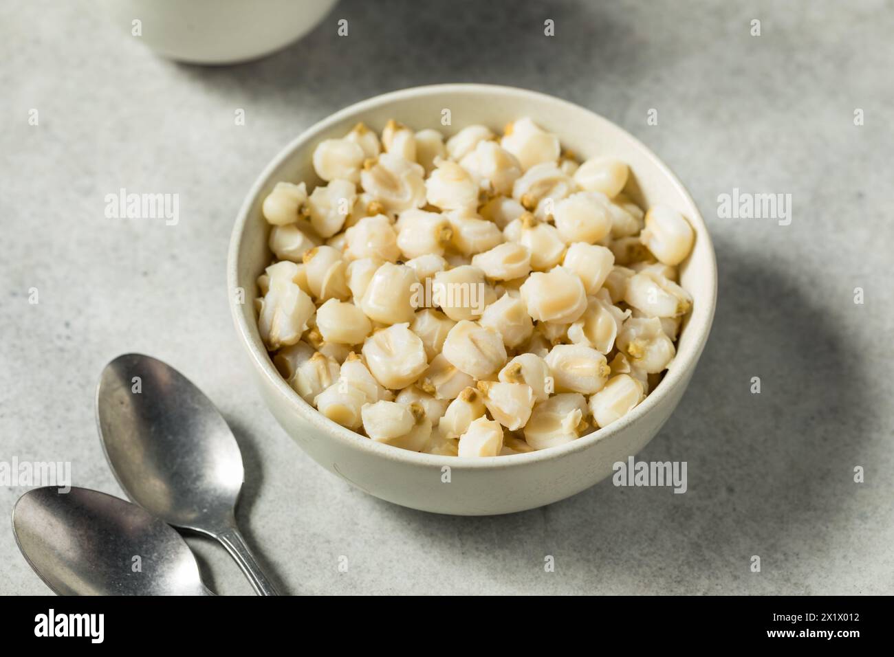 Raw Cooked White Mexican Hominy Corn in a Bowl Stock Photo - Alamy