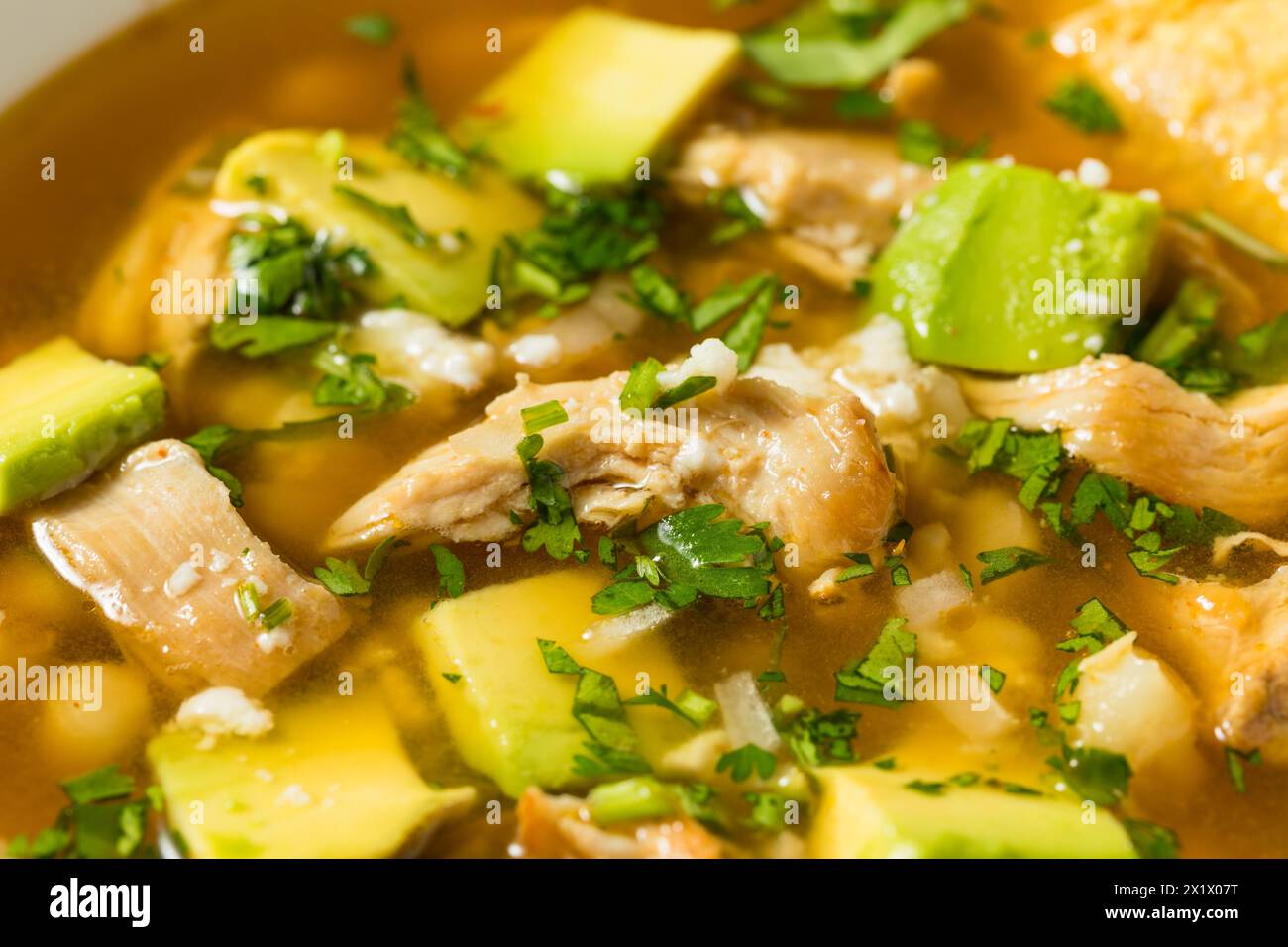 Homemade Mexican Chicken Pozole Soup with Tortilla Chips Stock Photo ...
