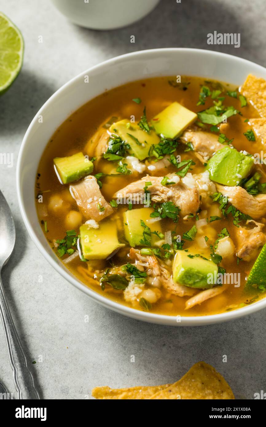 Homemade Mexican Chicken Pozole Soup with Tortilla Chips Stock Photo ...