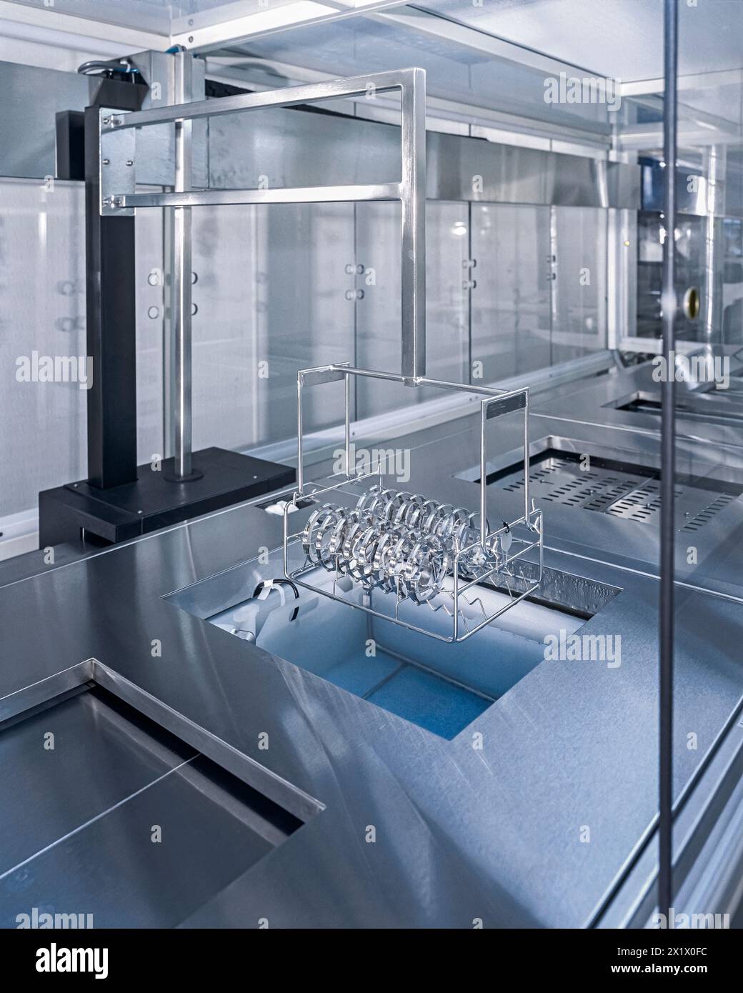 A rack of eyeglass lenses in metal retainer has just come out of a ...