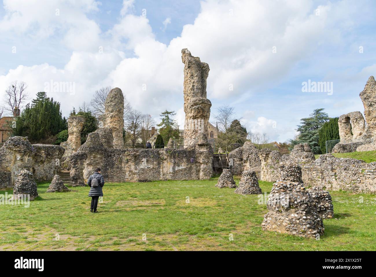 Lady surveying remains of St Mary's Chapel Great Benedictine Monastery ...