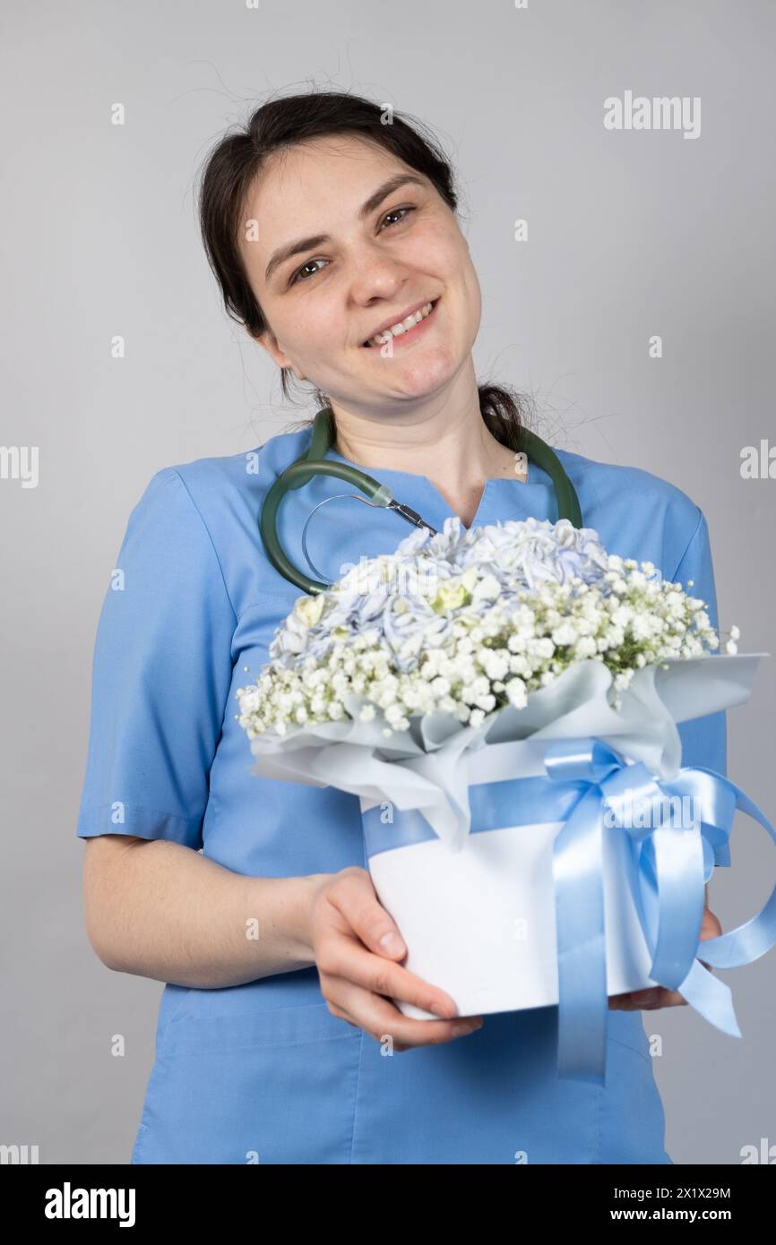 Doctor cardiologist therapist holds heart hi-res stock photography and ...