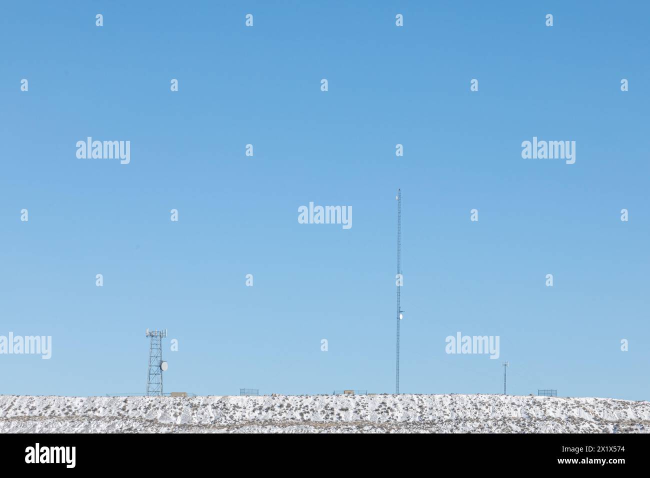 several communication towers on a hillside Stock Photo - Alamy