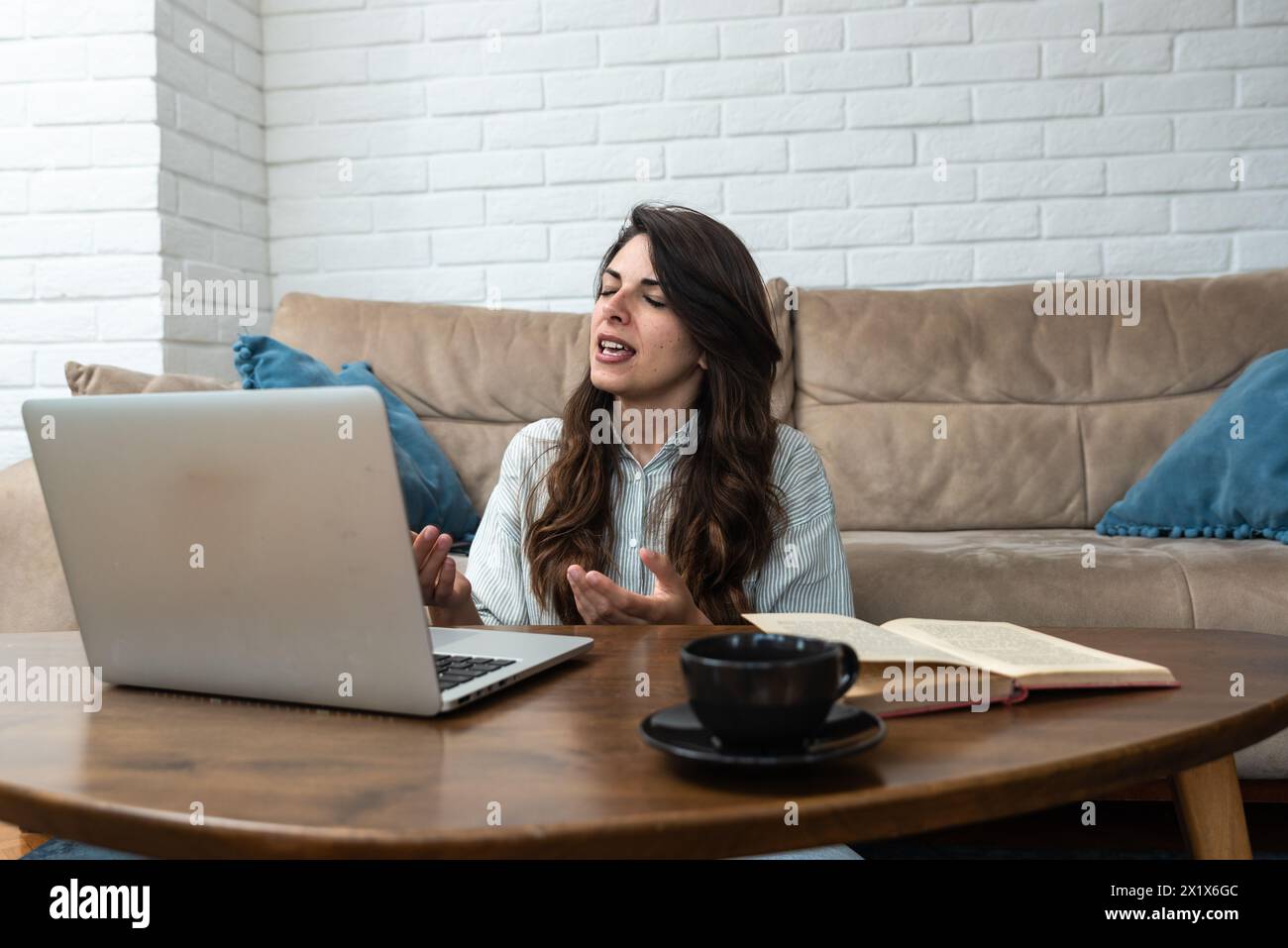 Young freelance graphic designer woman has a problem with attention ...