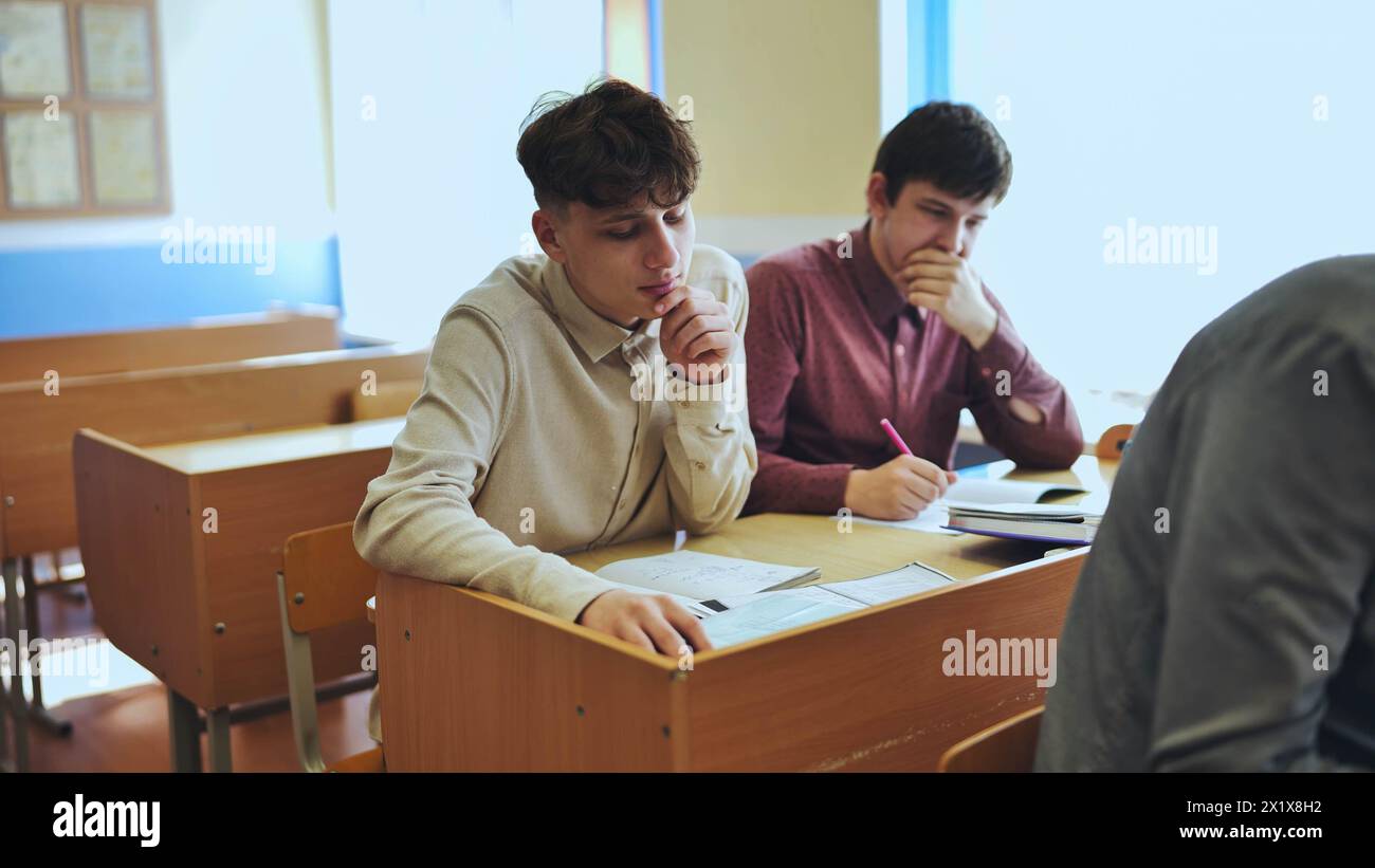 Schoolboys desk during class hi-res stock photography and images - Alamy
