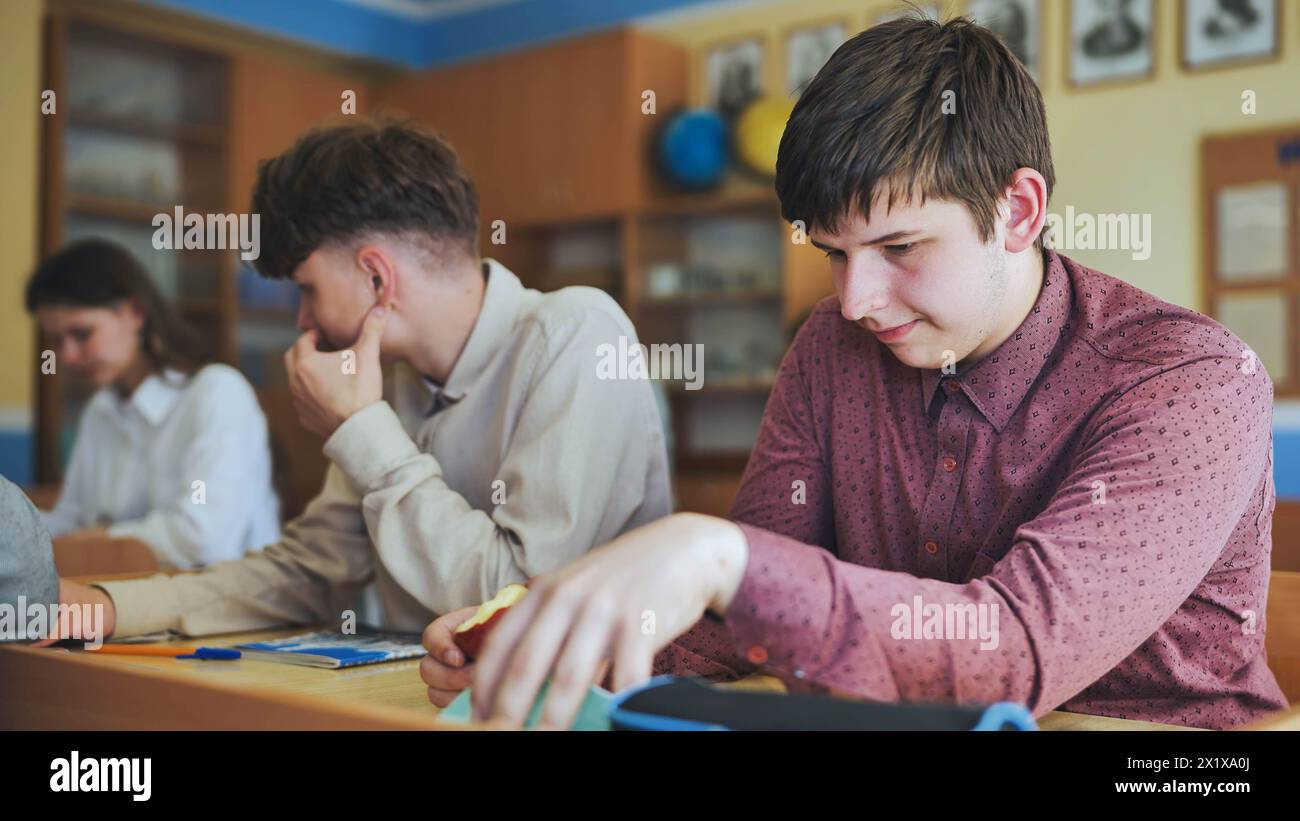 Schoolboys desk during class hi-res stock photography and images - Alamy