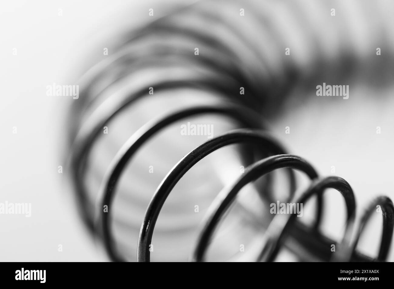 Metal spring coiled, black and white macro shot, soft focus, abstract ...