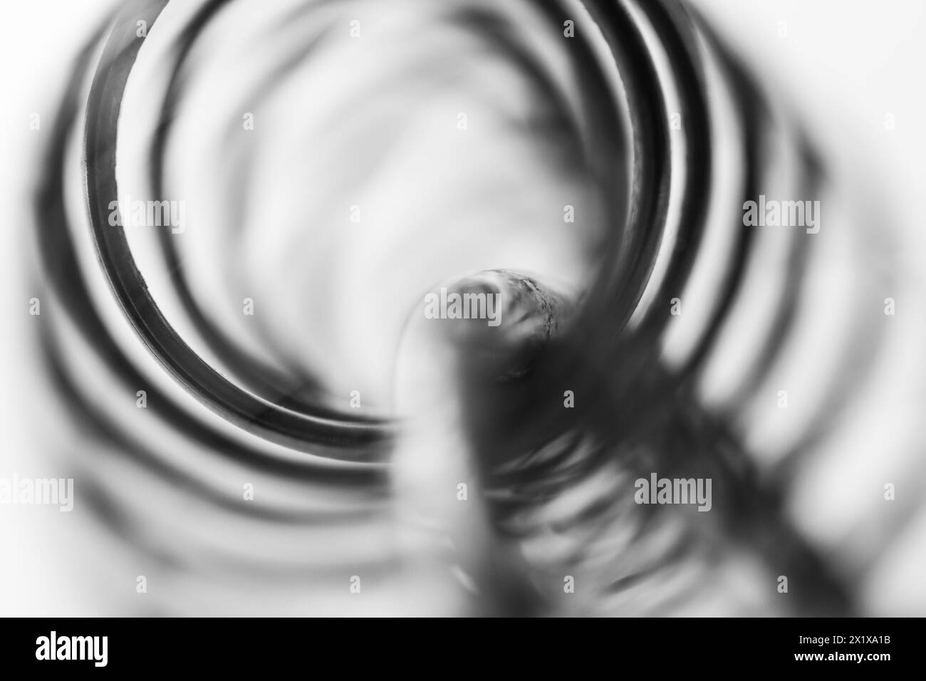 Metal spring coiled, black and white macro shot, soft focus, abstract ...