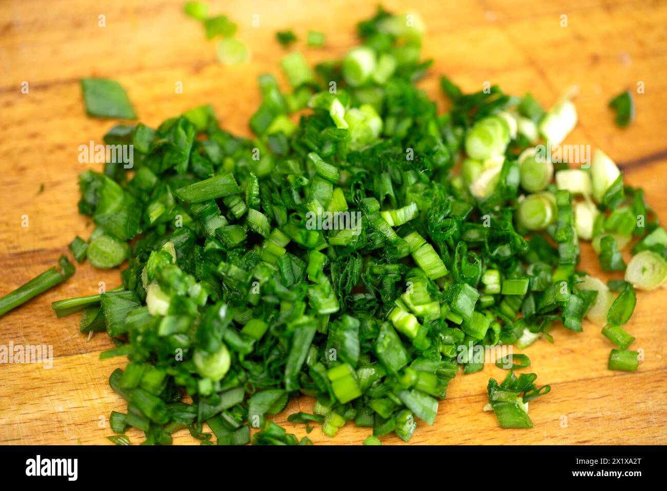 Chopped chives, green background, full frame Stock Photo - Alamy