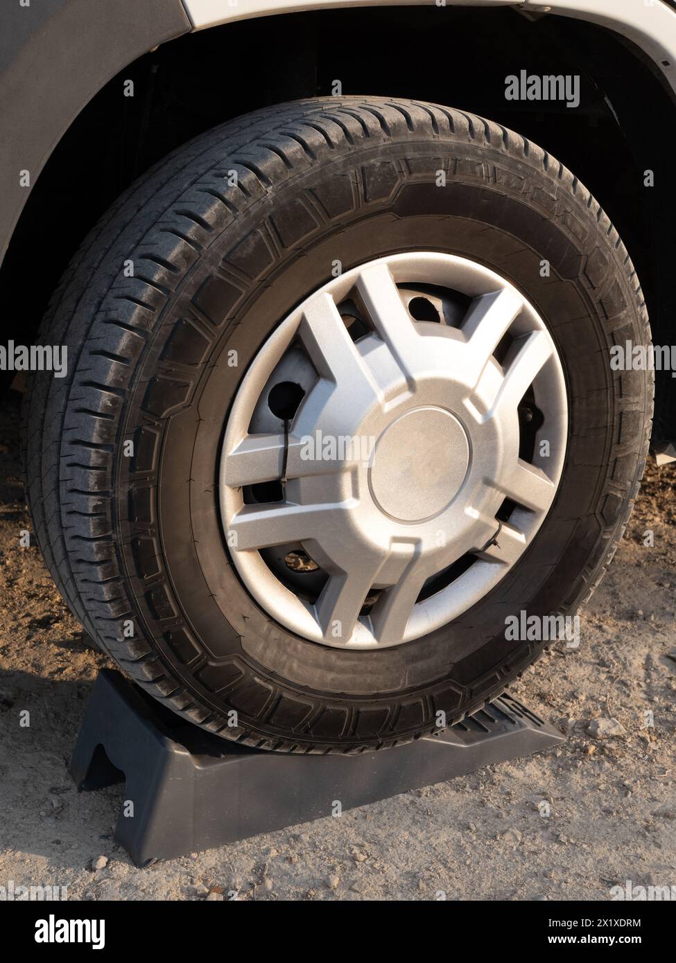 Level up chock block for motor home wheel Stock Photo - Alamy