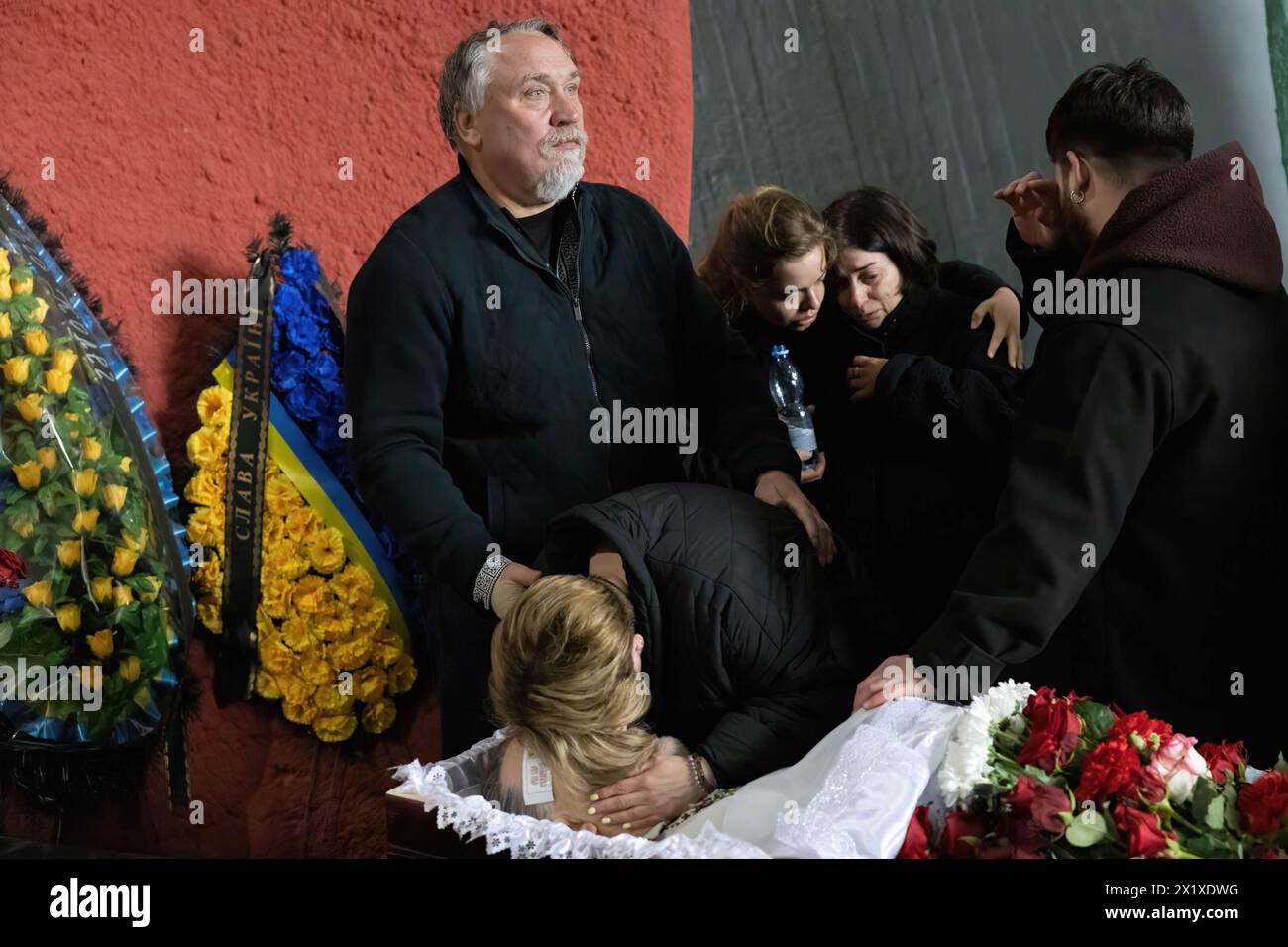(EDITORS NOTE: Image depicts death) Relatives mourn near the coffin ...