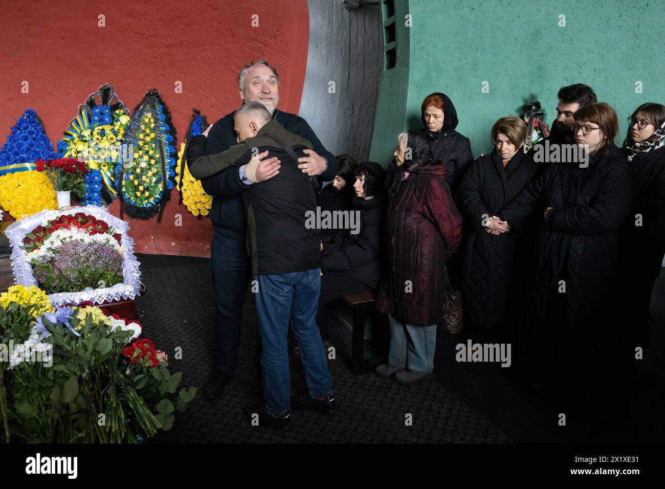 Kyiv, Ukraine. 18th Apr, 2024. A twin brother accepts condolences near ...