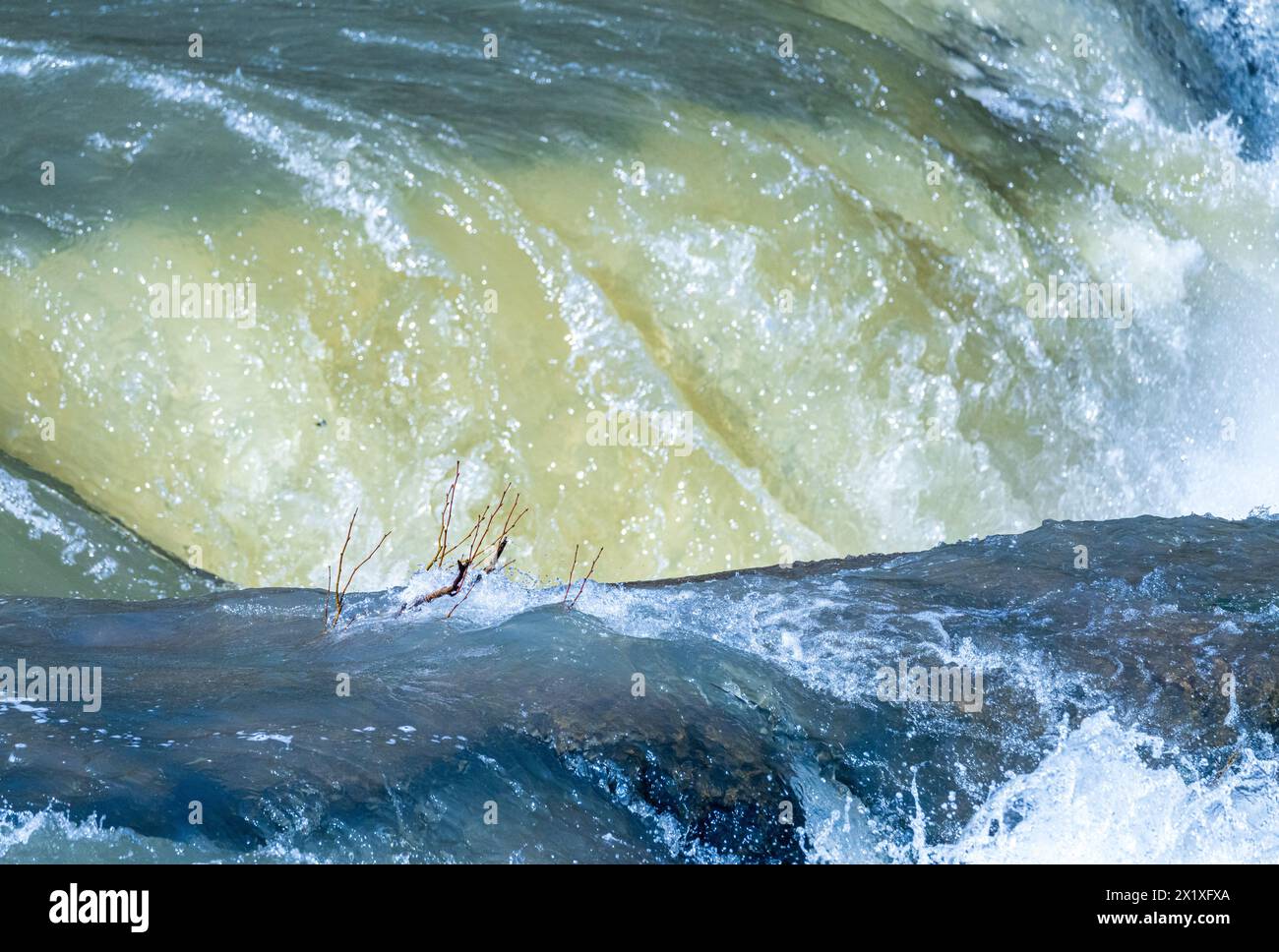 Frozen motion view of raging water flowing over rocks of Valley Falls ...