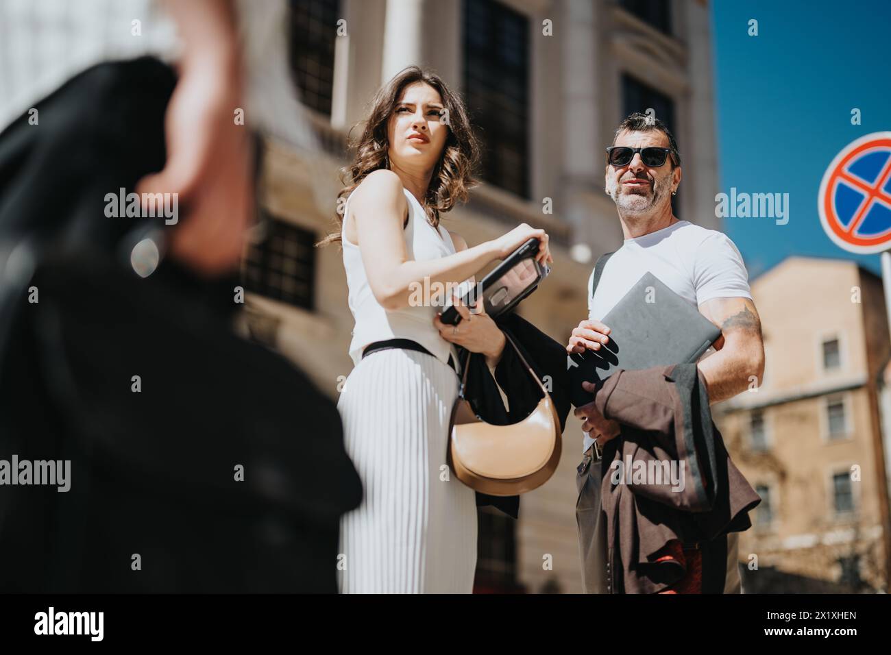 Cross-generational business executives discussing strategies in urban ...