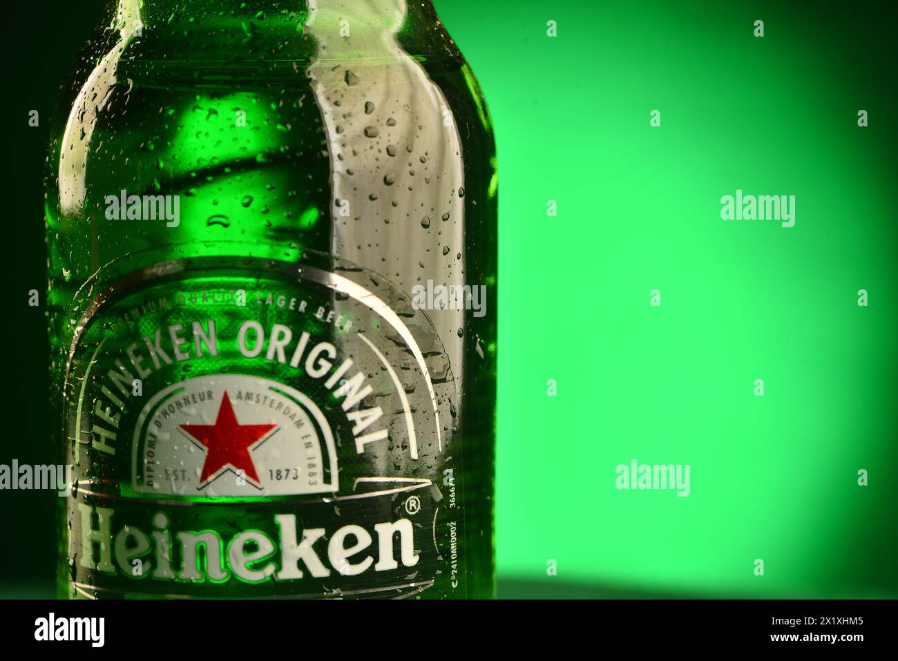 Bottle of Heineken beer on green background Stock Photo - Alamy