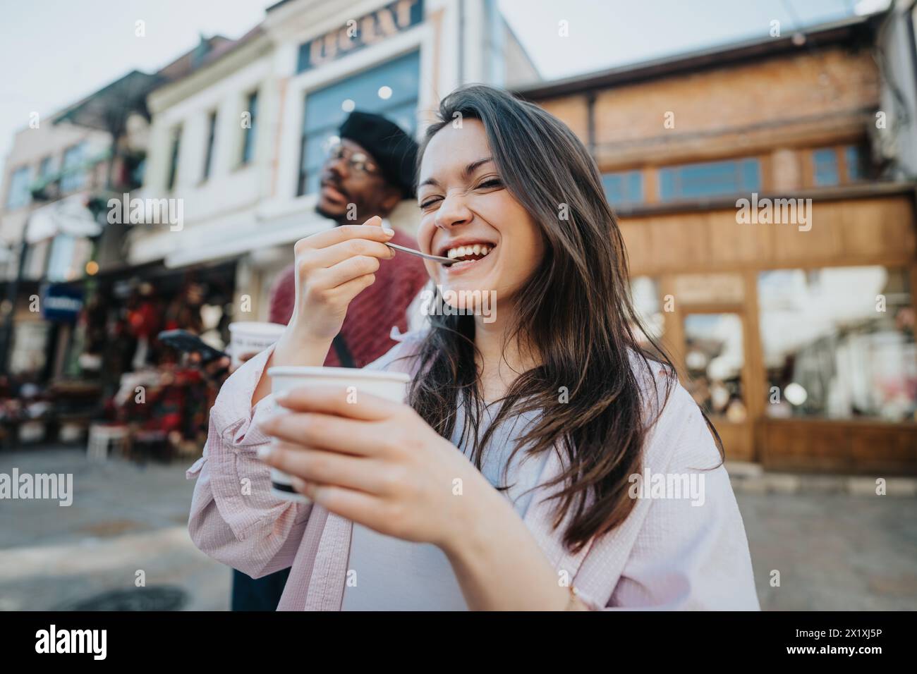 Man and woman walking eating ice cream hi-res stock photography and ...