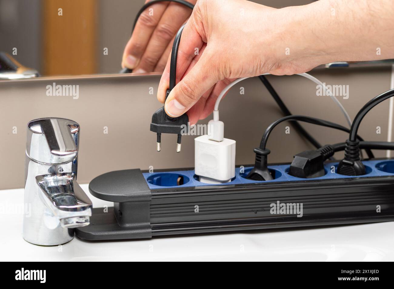 Woman hand plugging hi-res stock photography and images - Alamy