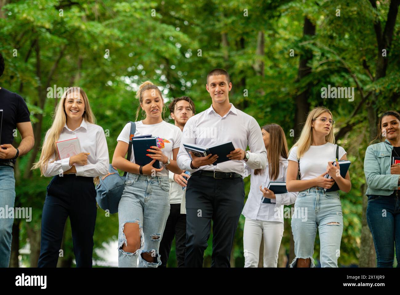 Big group of young students going back to school Stock Photo - Alamy